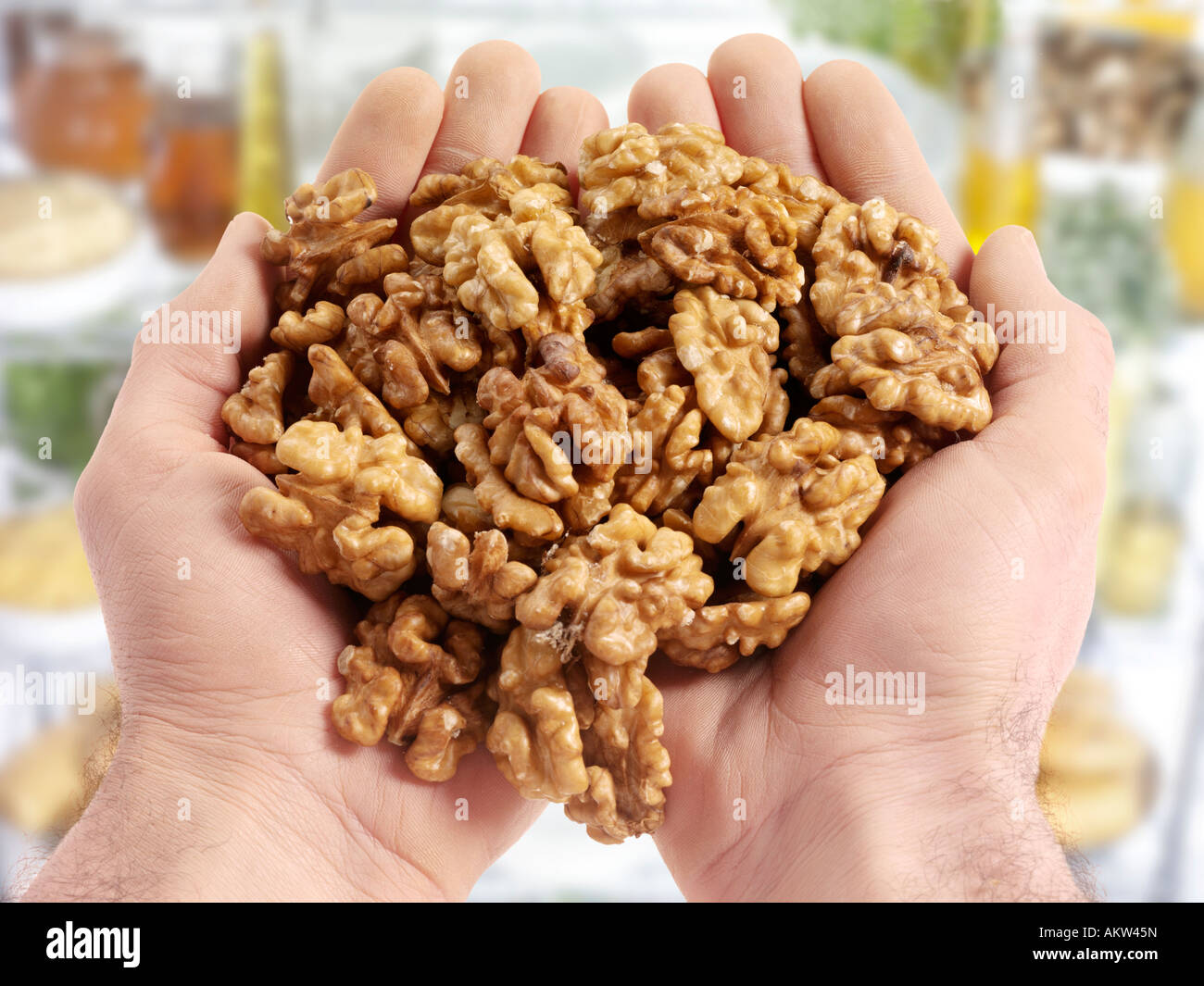 Hands holding handful walnuts hi-res stock photography and images - Alamy