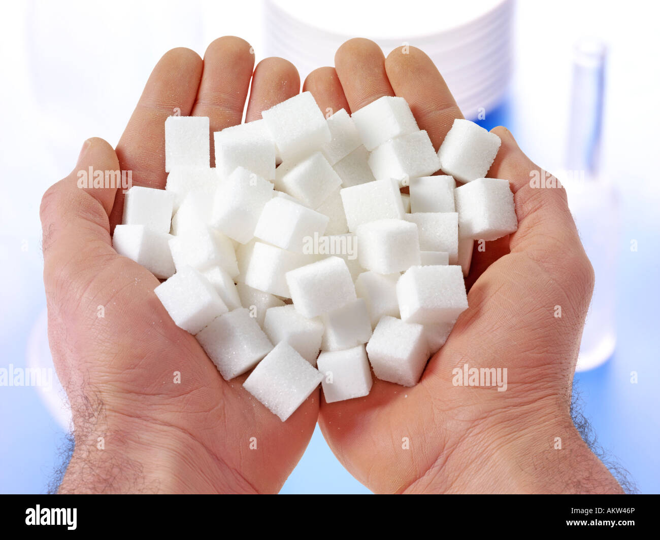 HANDFUL OF WHITE SUGAR CUBES Stock Photo - Alamy