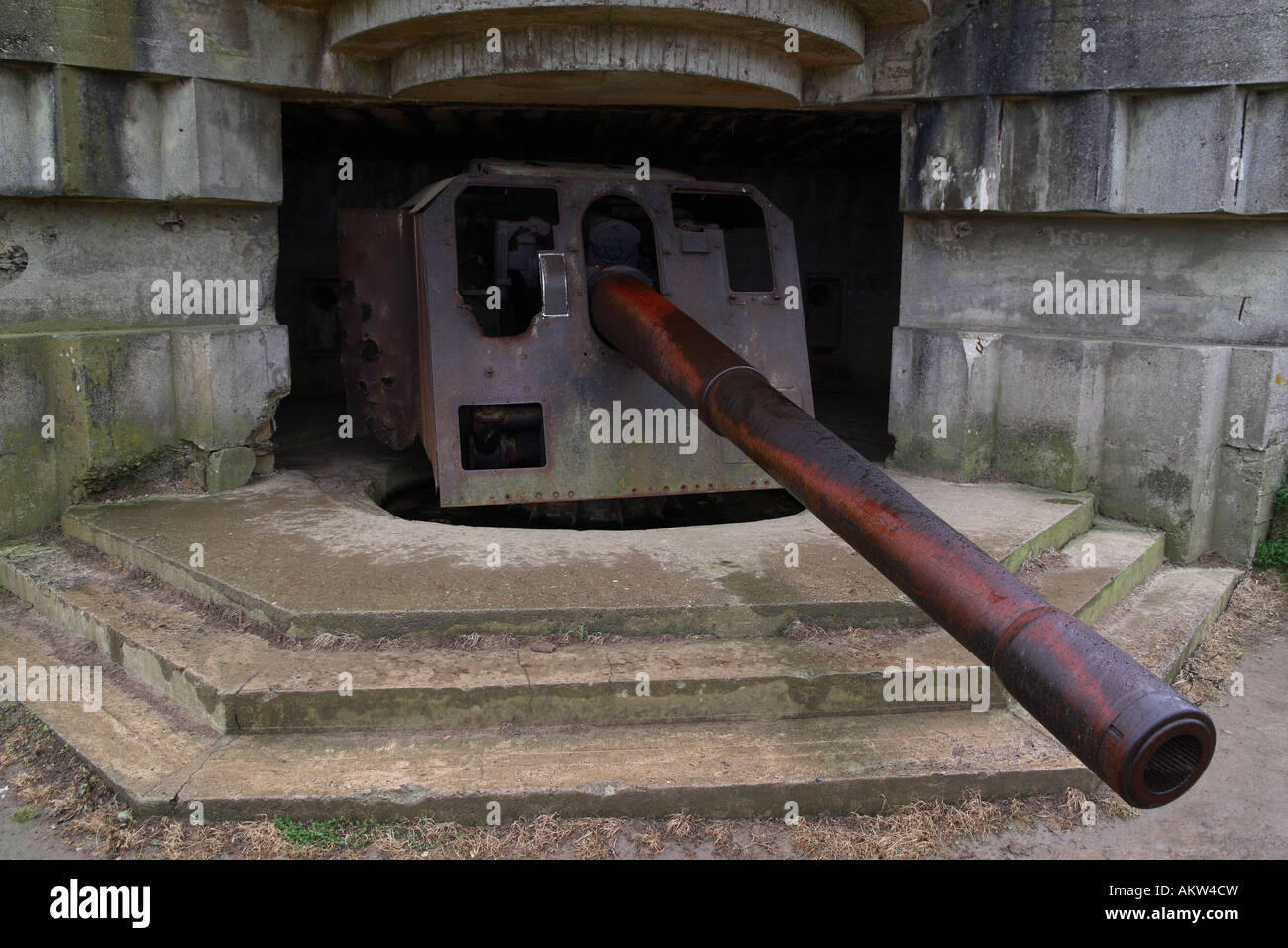A rusting German gun in its bunker at Longues sur Mer in Normandy ...