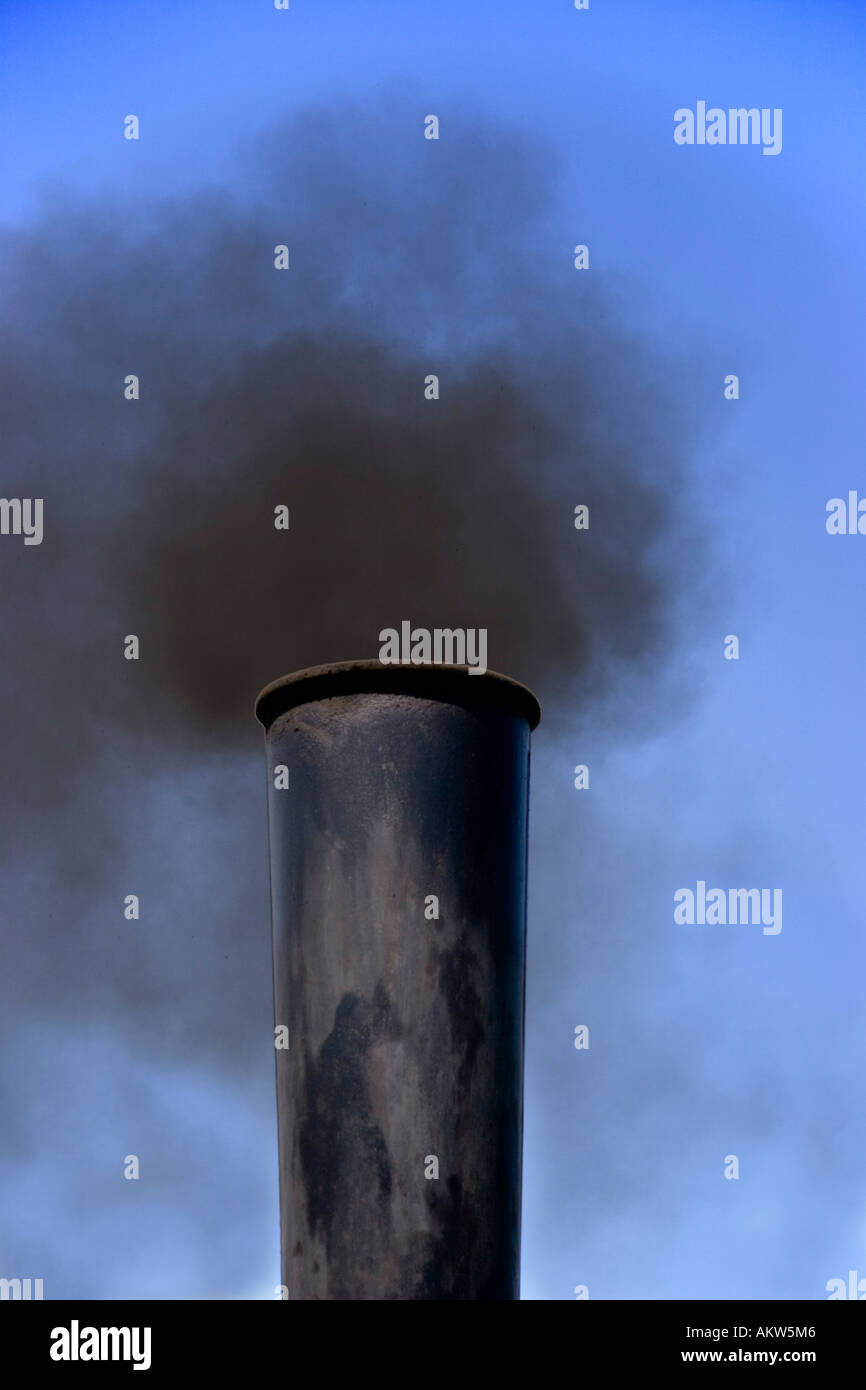 Smoking chimney of a restored steam traction engine on display at a ...