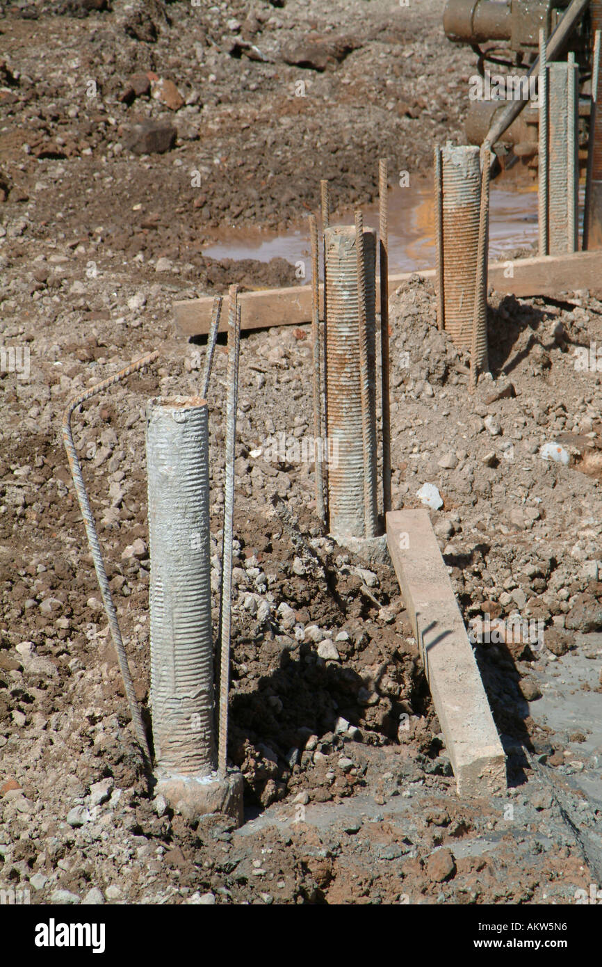 Piles driven into the ground on a building site in the UK Stock Photo ...