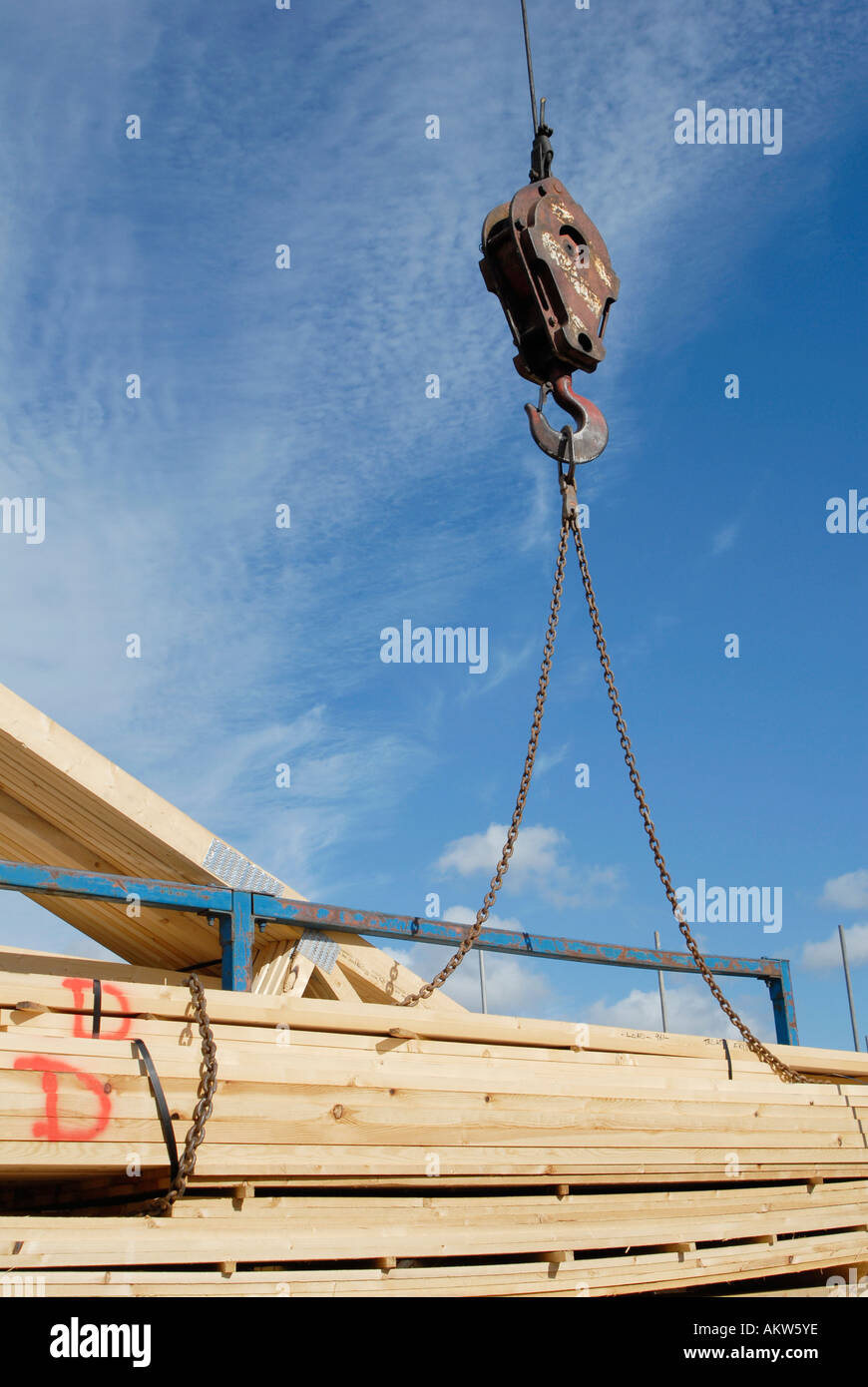 Timber being lifted by a crane on a construction site in the uk Stock ...