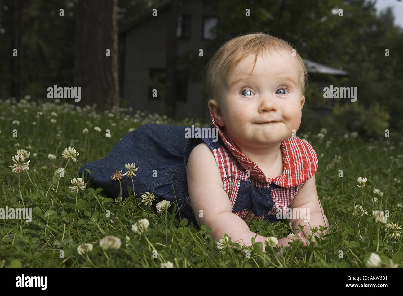 Child grass sod lying hi-res stock photography and images - Alamy