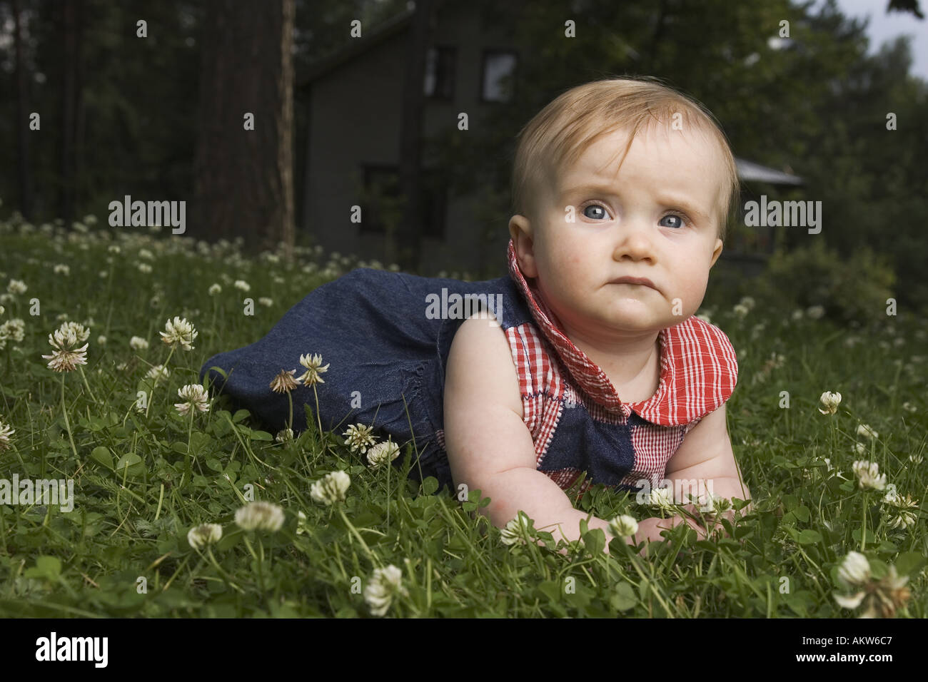 Child grass sod lying hi-res stock photography and images - Alamy