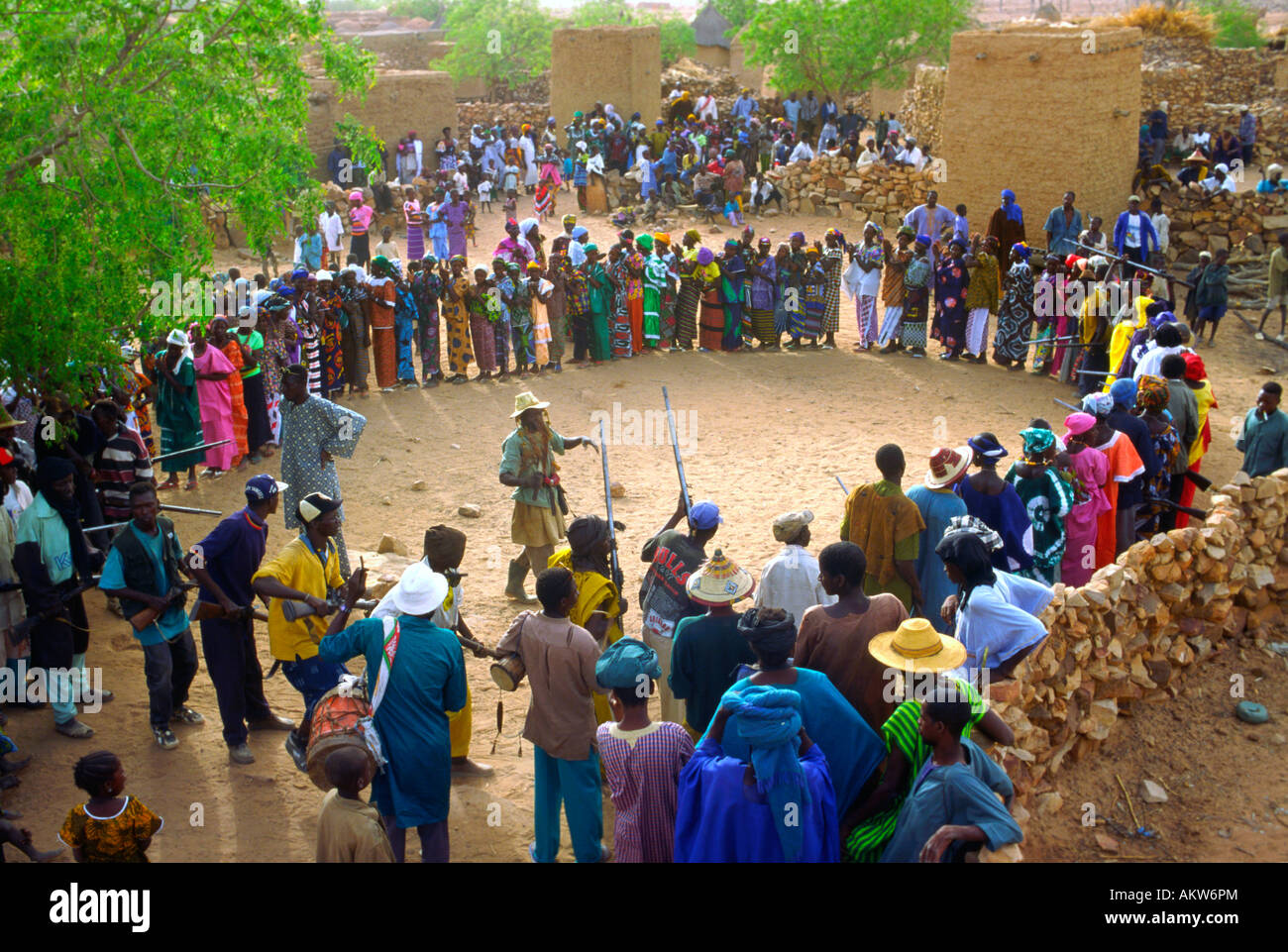 Villagers line up and celebrate with music and dance in a tribute to a ...