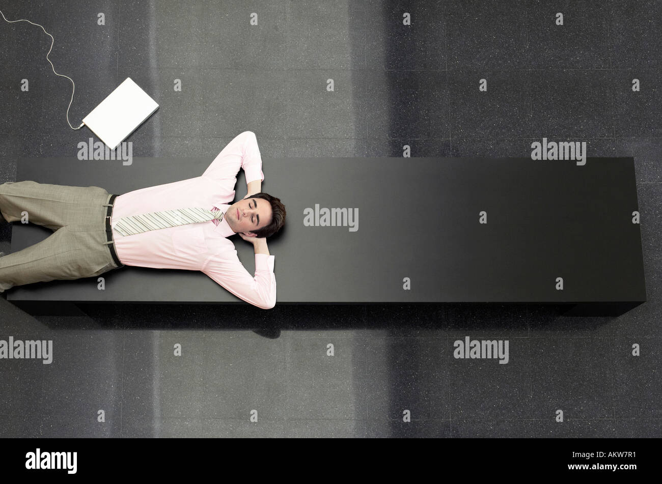 Businessman lying on bench hi-res stock photography and images - Alamy