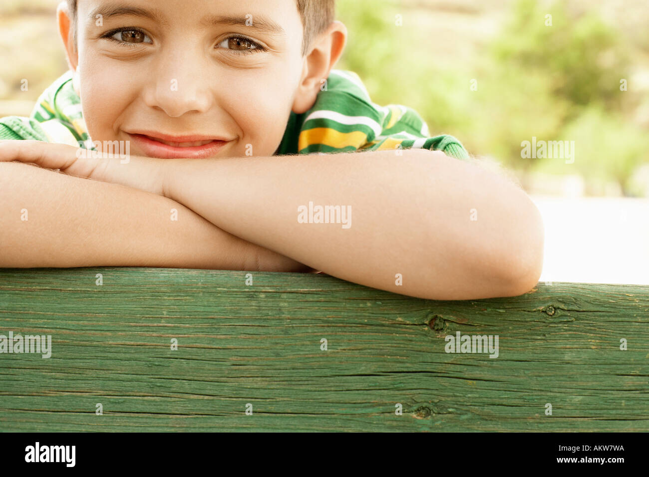 Boy leaning railing outdoors hi-res stock photography and images - Alamy
