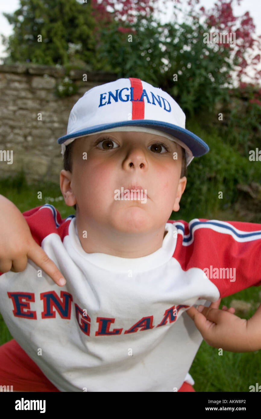 Small boy wearing England football shirt and baseball cap Stock Photo ...