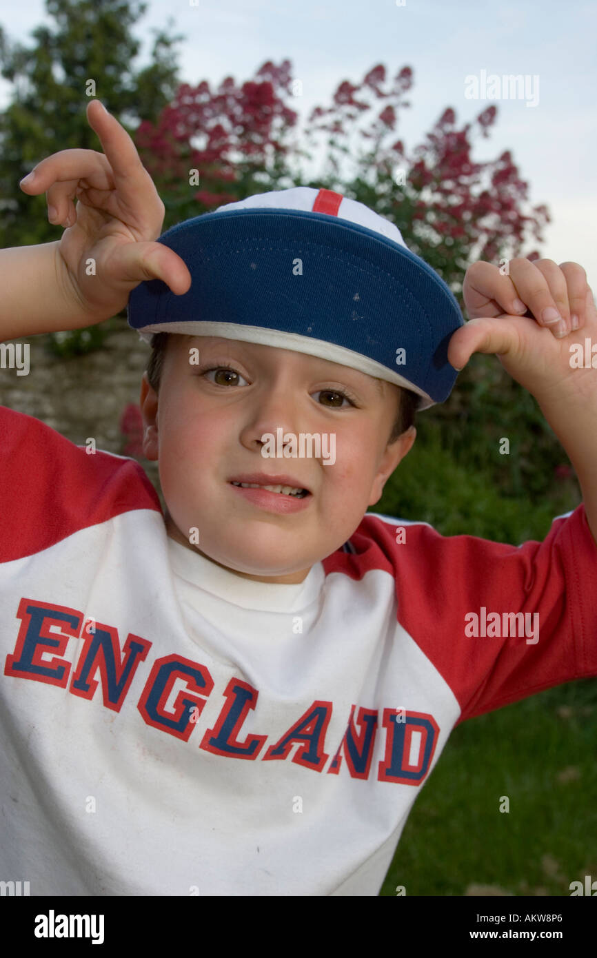 Small boy wearing England football shirt and baseball cap Stock Photo ...