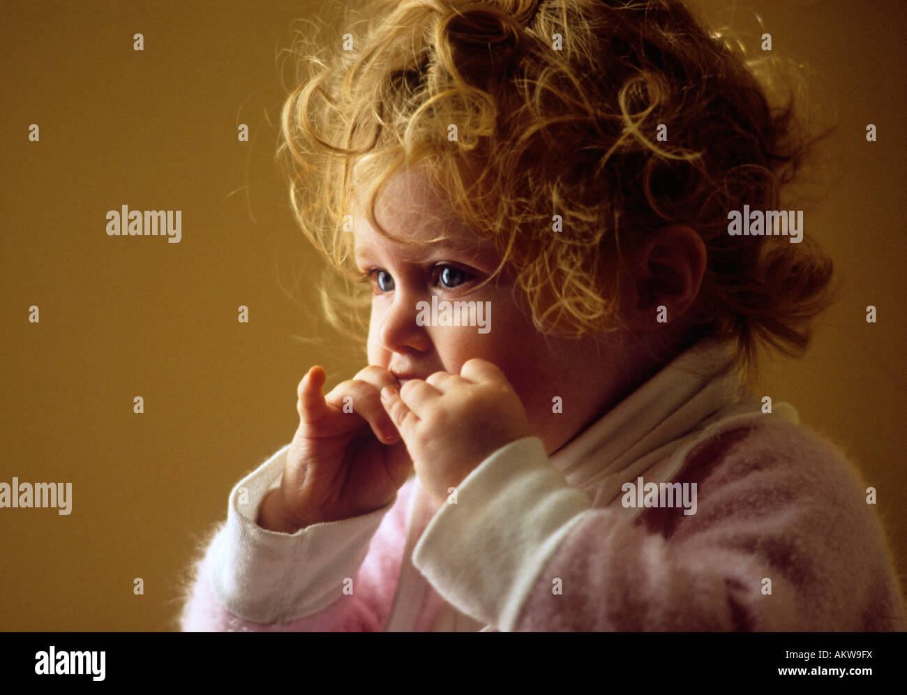 close-up girl child eating with curly hair Stock Photo - Alamy