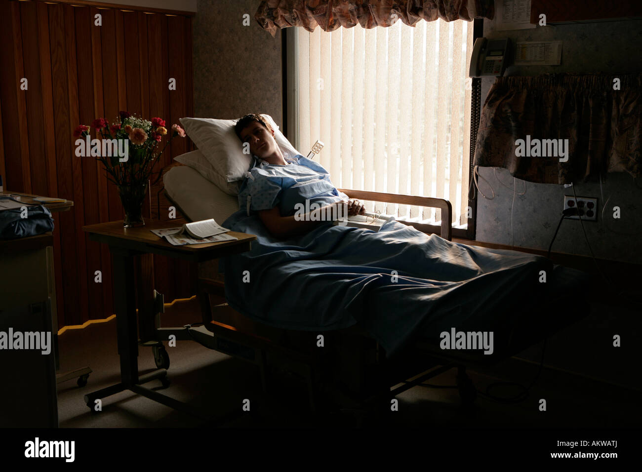 Man in a hospital bed Stock Photo - Alamy