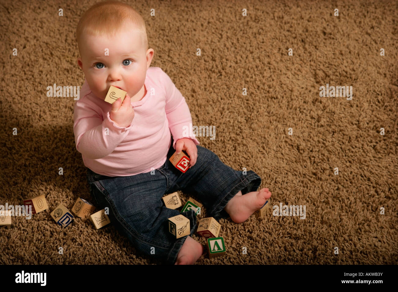 Baby playing with ABC blocks Stock Photo - Alamy