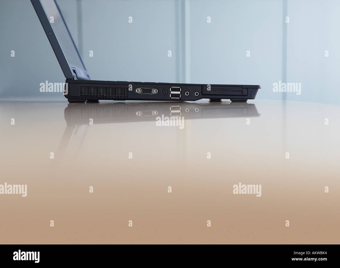 Laptop on desk, side view Stock Photo - Alamy