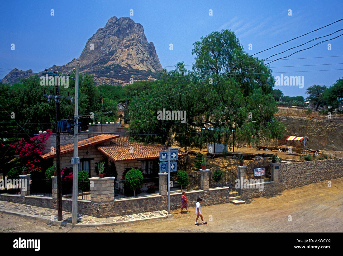 Mexicans, Mexican women, Pena de Bernal, monolith, massive rock, pueblo ...
