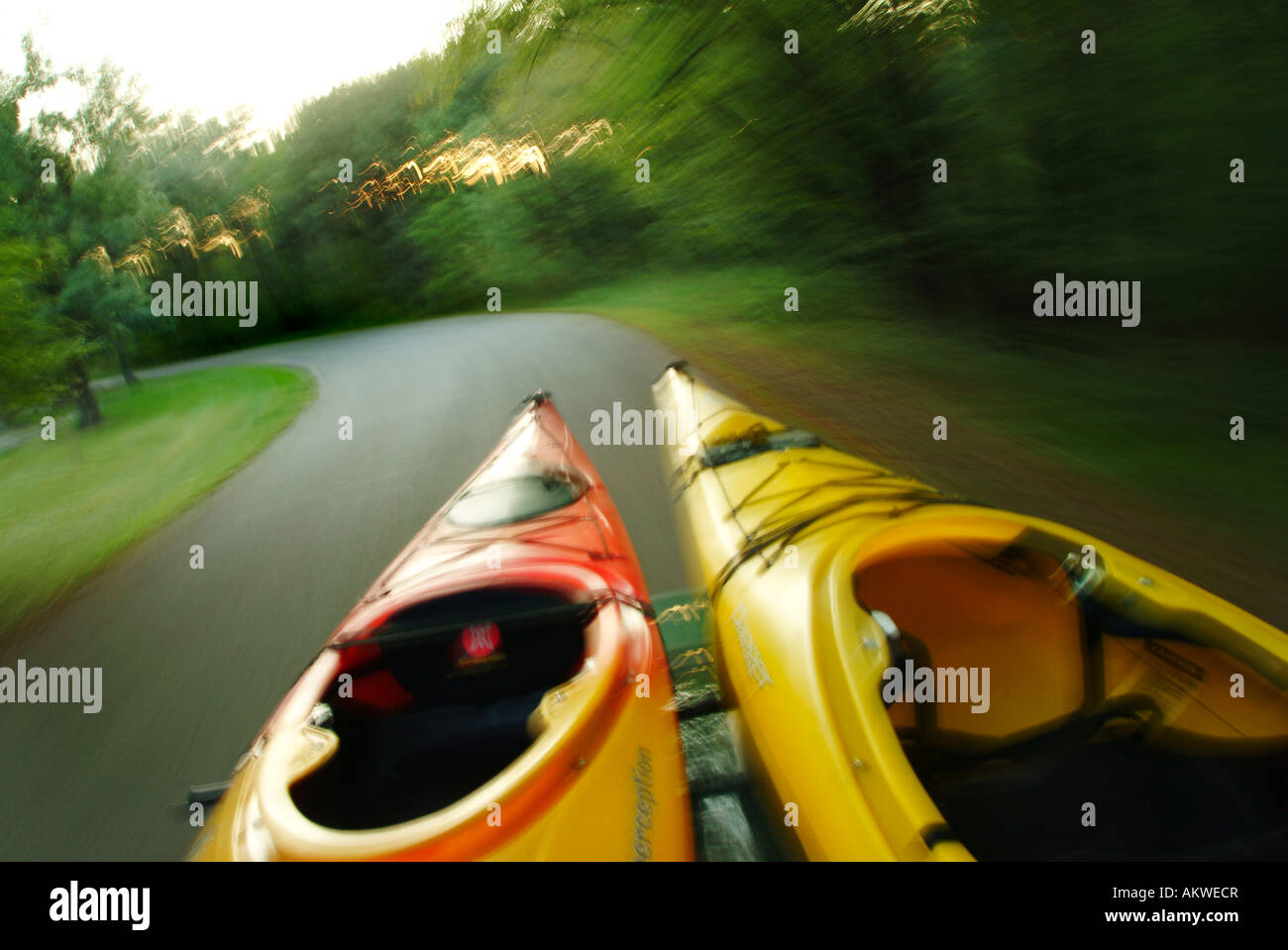 Kayaks on a roof rack as the car drives down a winding road Stock Photo ...