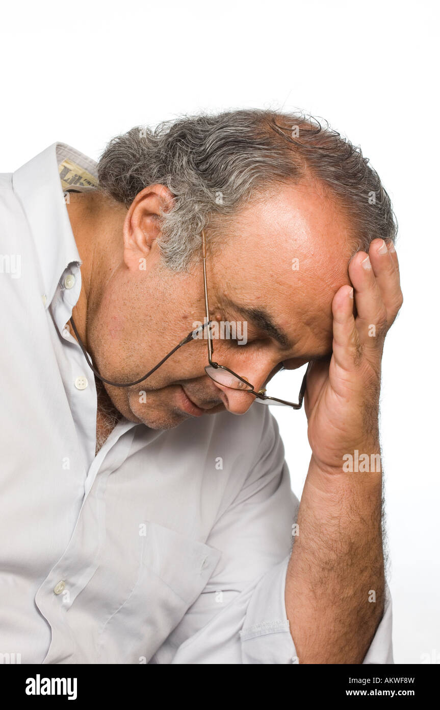 Depressed mature man head in hand Stock Photo - Alamy