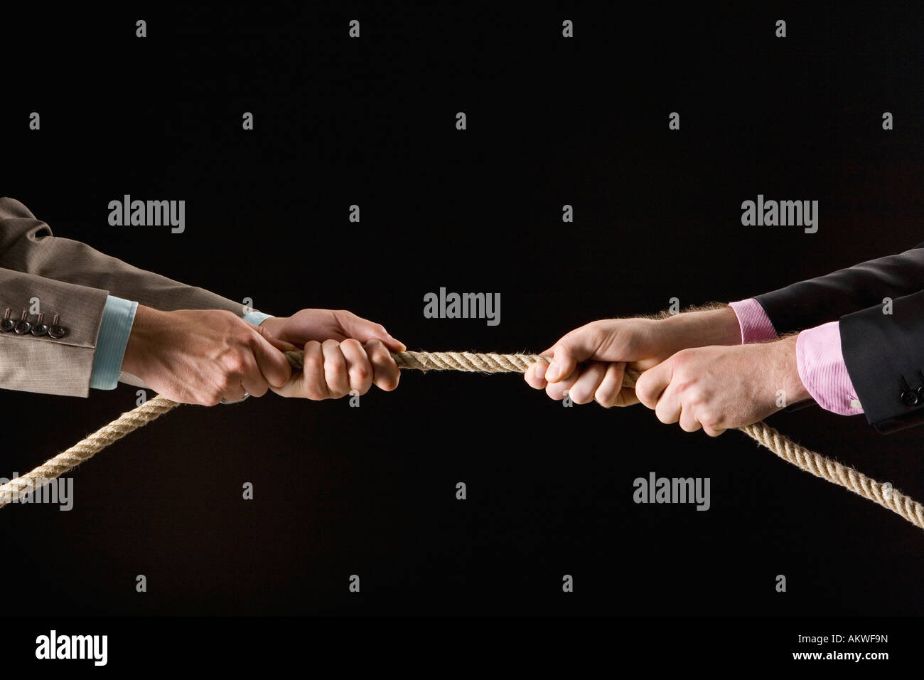 Two hands pulling rope hi-res stock photography and images - Alamy
