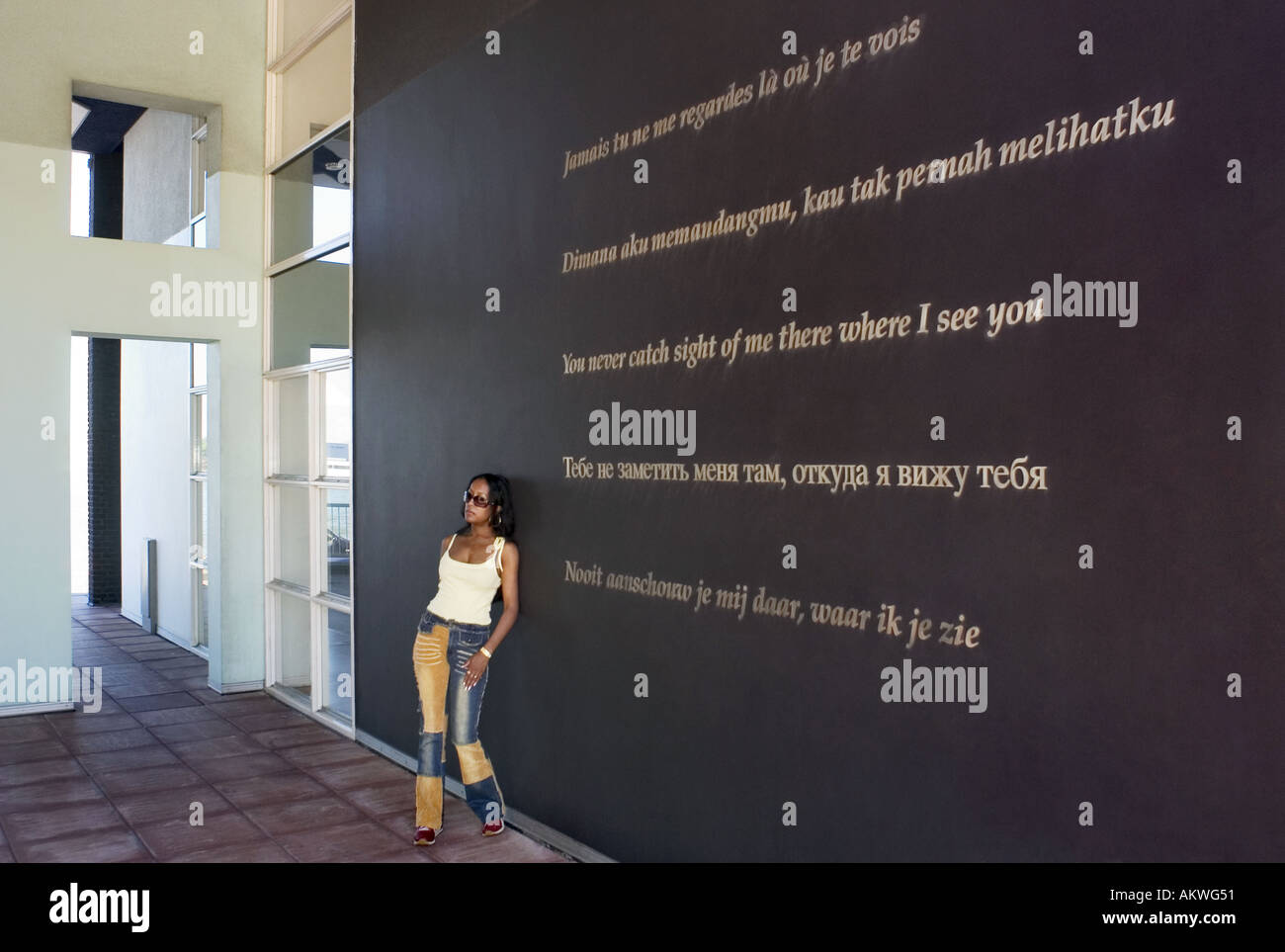 Girl lean on wall hi-res stock photography and images - Alamy