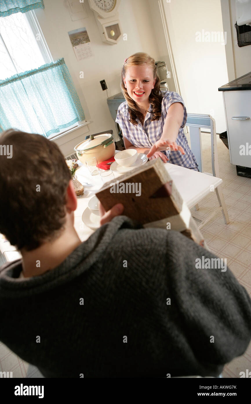 Reaching for a box Stock Photo - Alamy