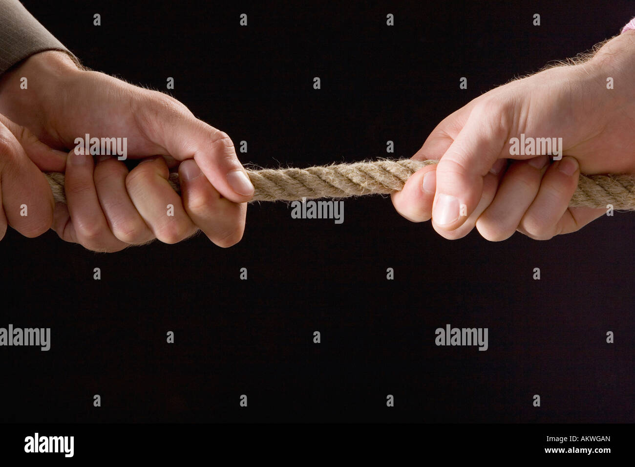 Two hands pulling rope hi-res stock photography and images - Alamy