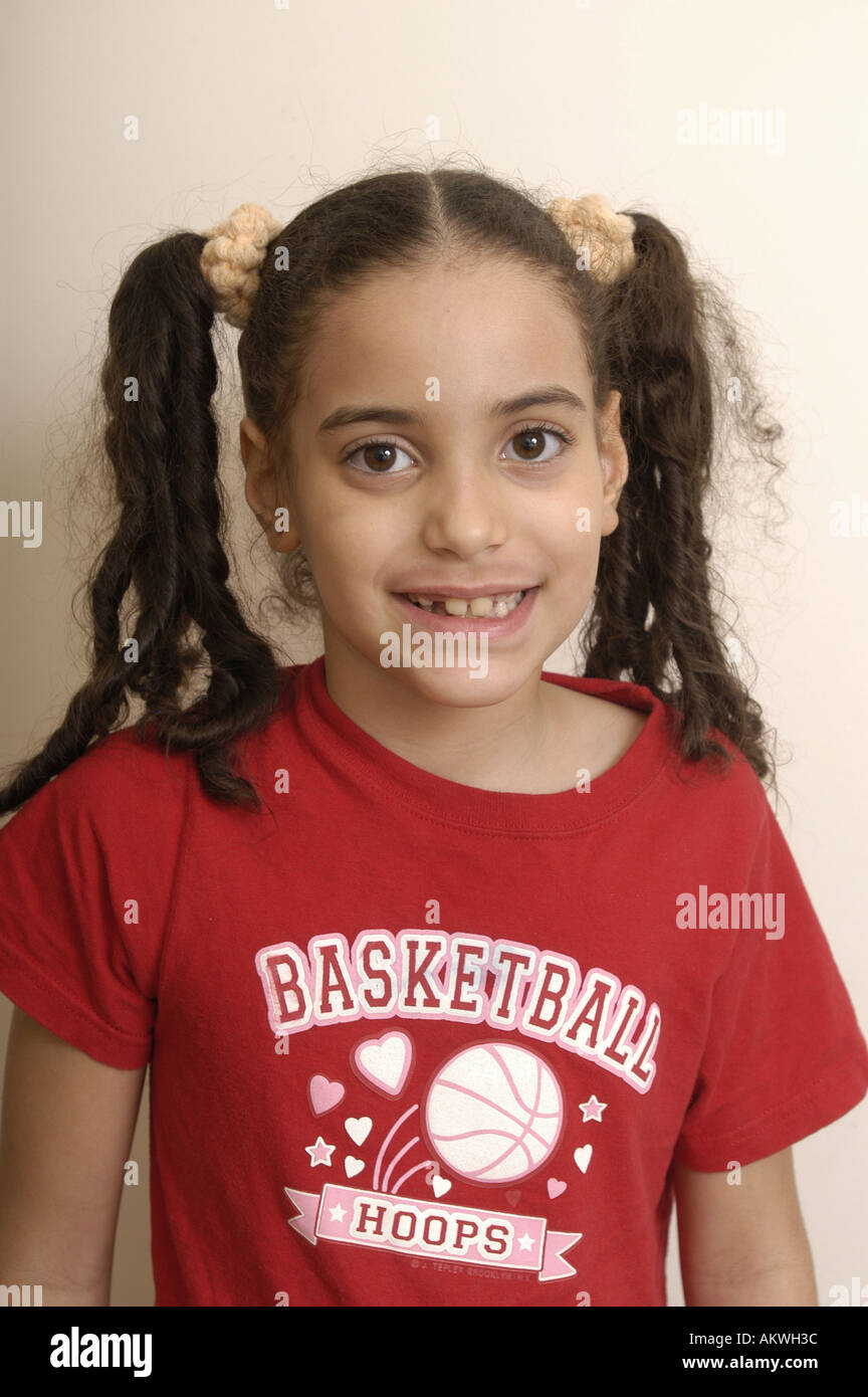 A portrait of a young, smiling Hispanic girl Stock Photo - Alamy