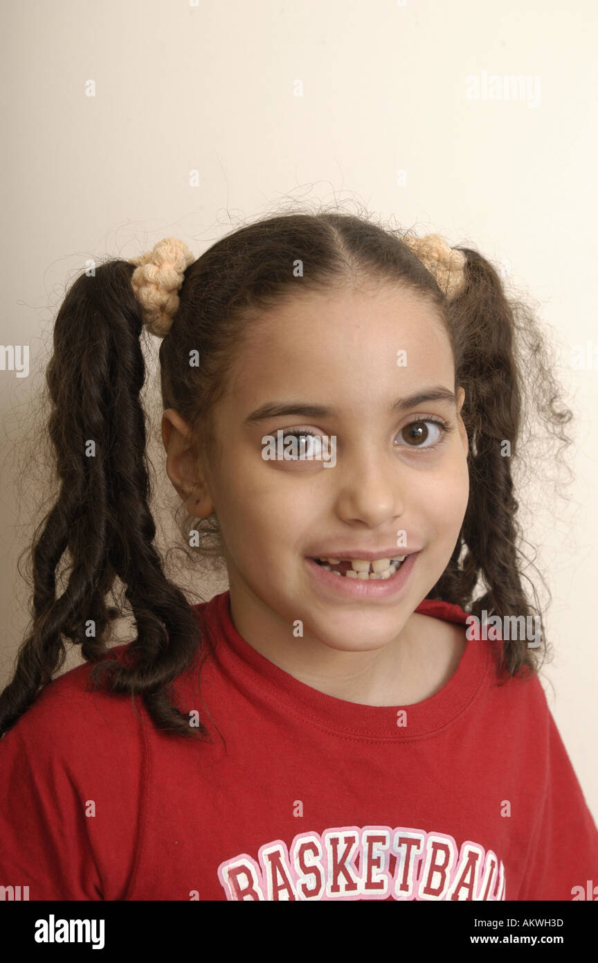 A portrait of a young, smiling Hispanic girl Stock Photo - Alamy