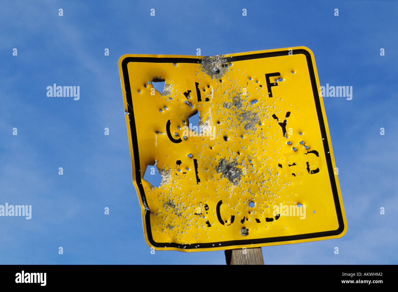 Sign, Target practice on road sign Stock Photo - Alamy