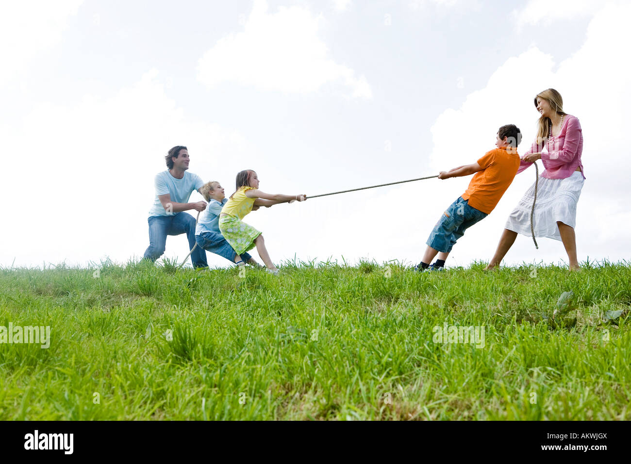 Family pulling rope, close-up Stock Photo - Alamy