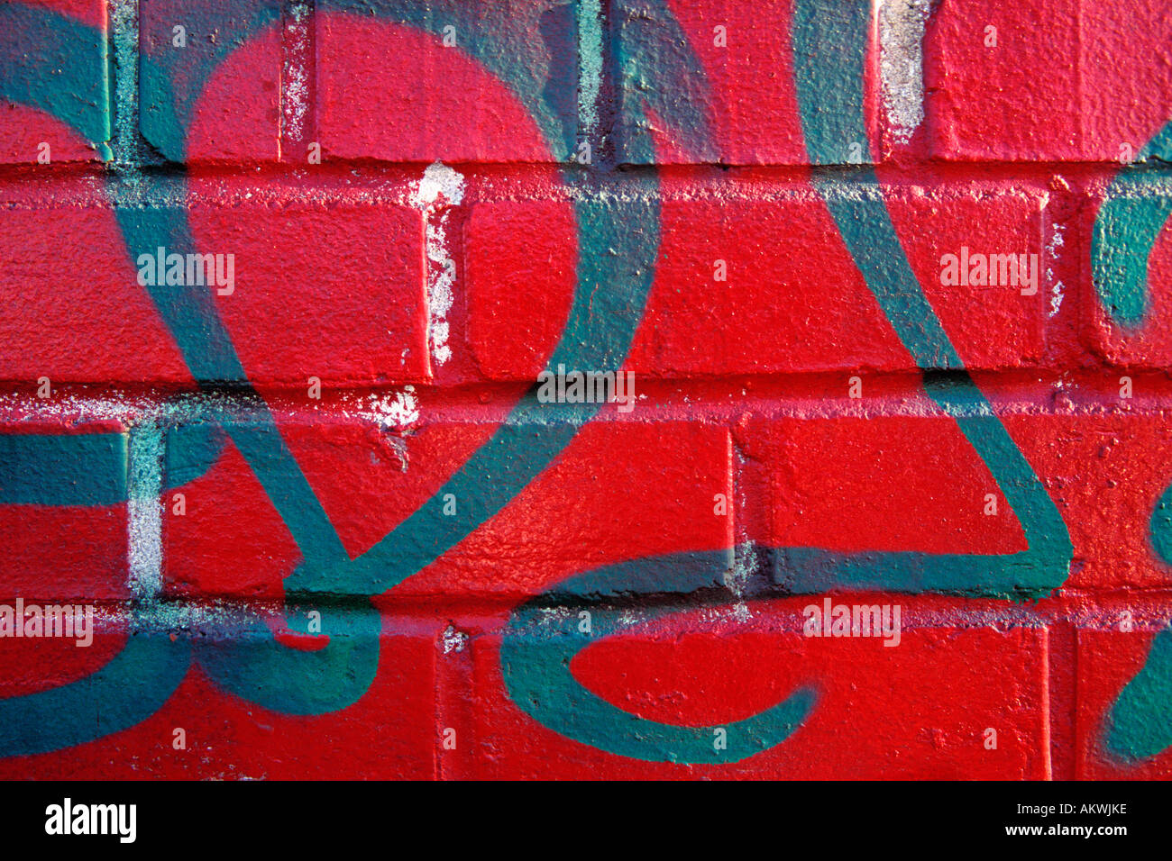 Patterns, Red brick wall with graffiti Stock Photo - Alamy