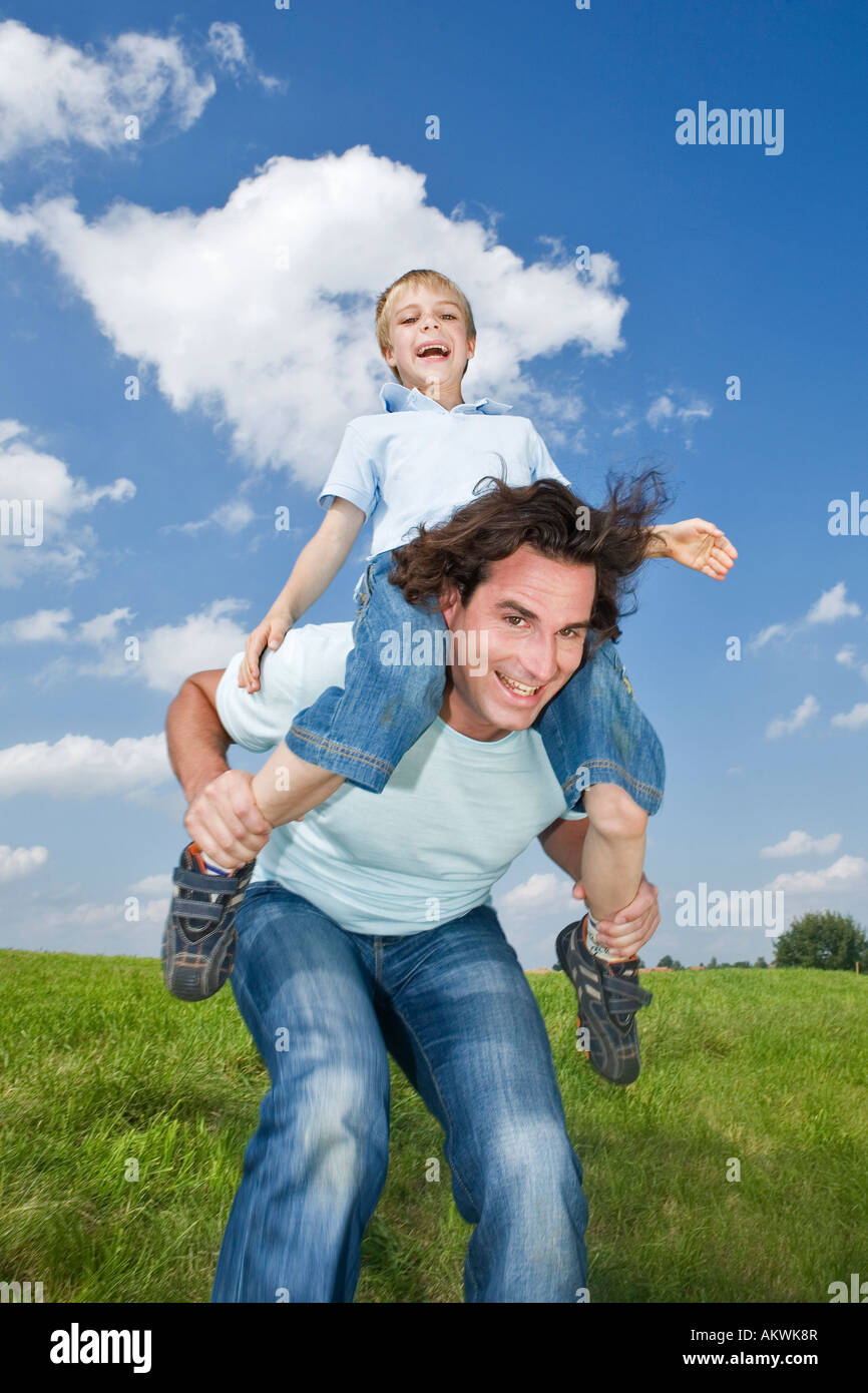 Dad piggy back kids hi-res stock photography and images - Alamy