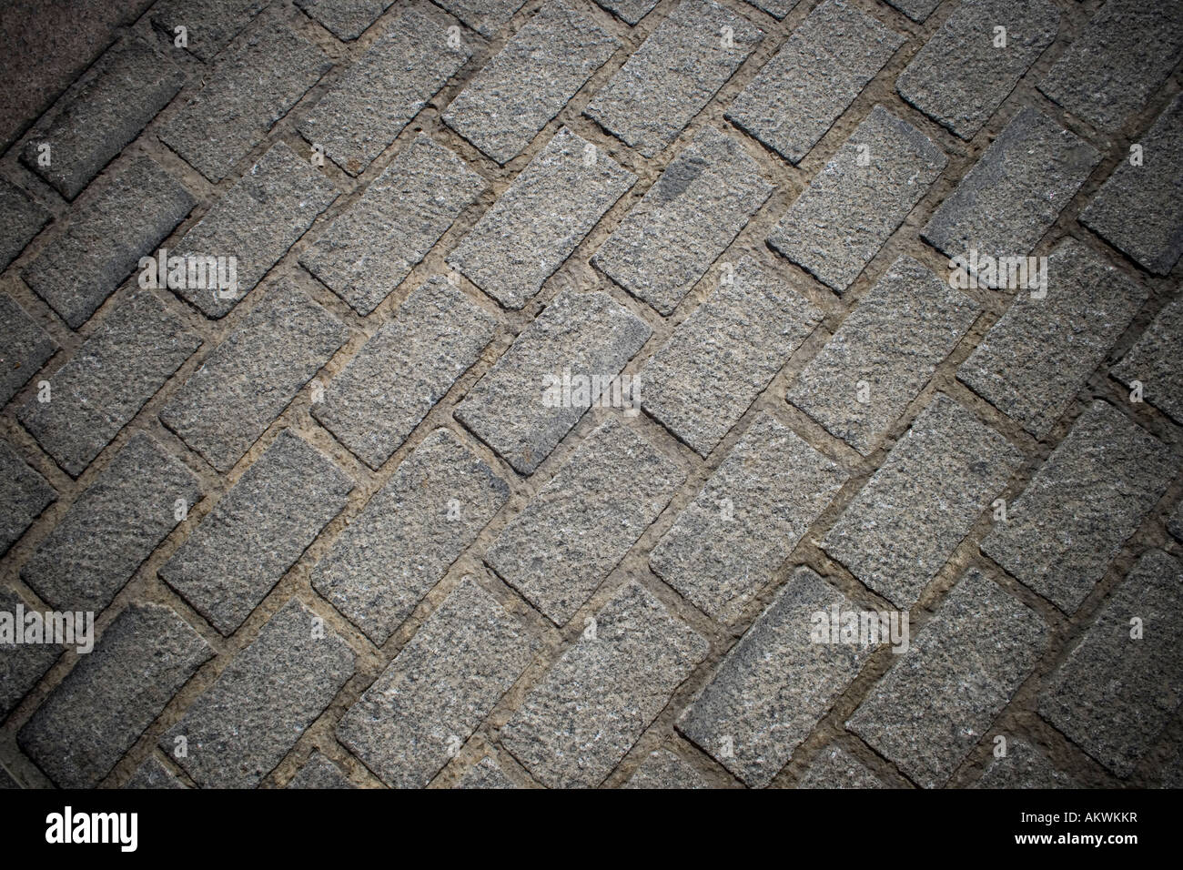Little granite paving stones in diagonal - texture Stock Photo - Alamy