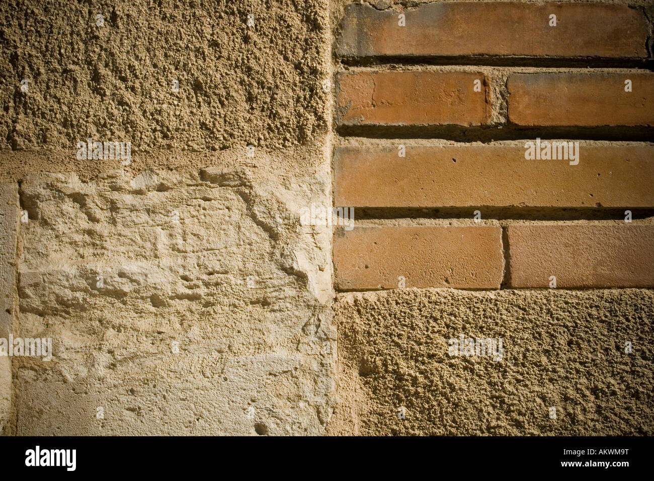 Mixed stone and bricks from a wall - texture Stock Photo - Alamy