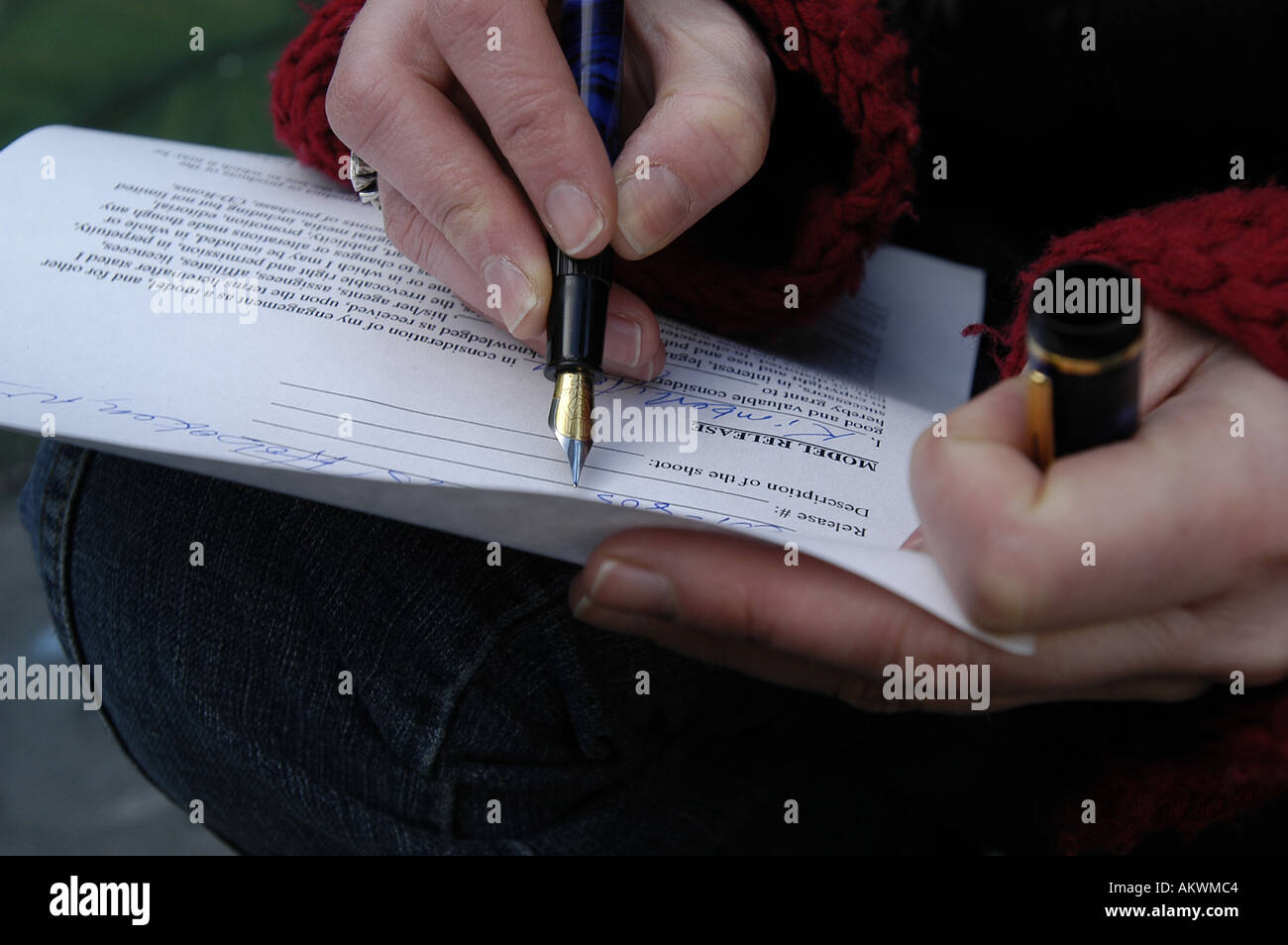 A close-up of a hand writing in a journal Stock Photo - Alamy