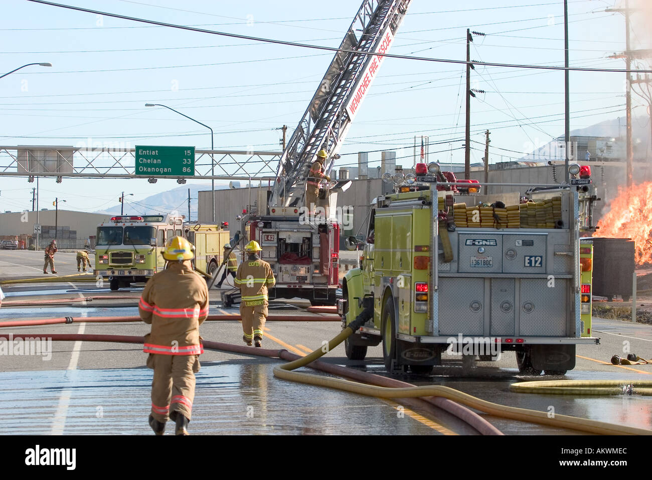 Firemen at an industrial fire scene Stock Photo - Alamy