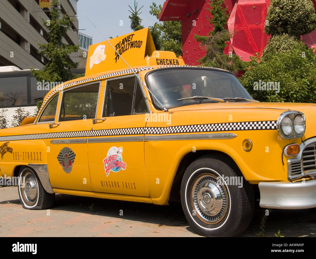 A yellow checker cab outside the Planet Hollywood restaurant on Falls ...