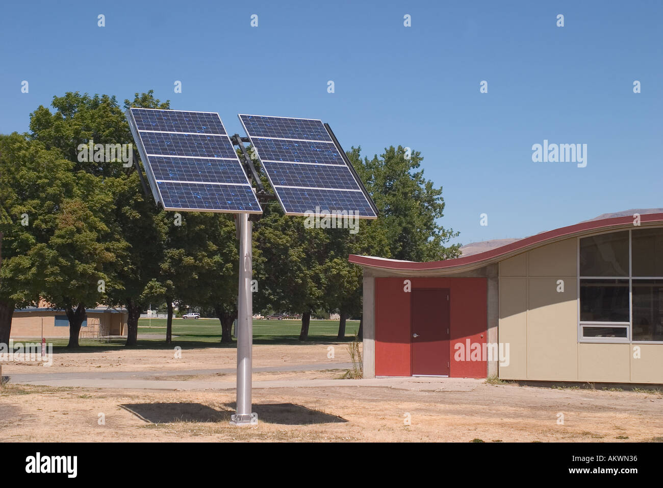 Solar panels on a pole supplying energy to a school Stock Photo - Alamy