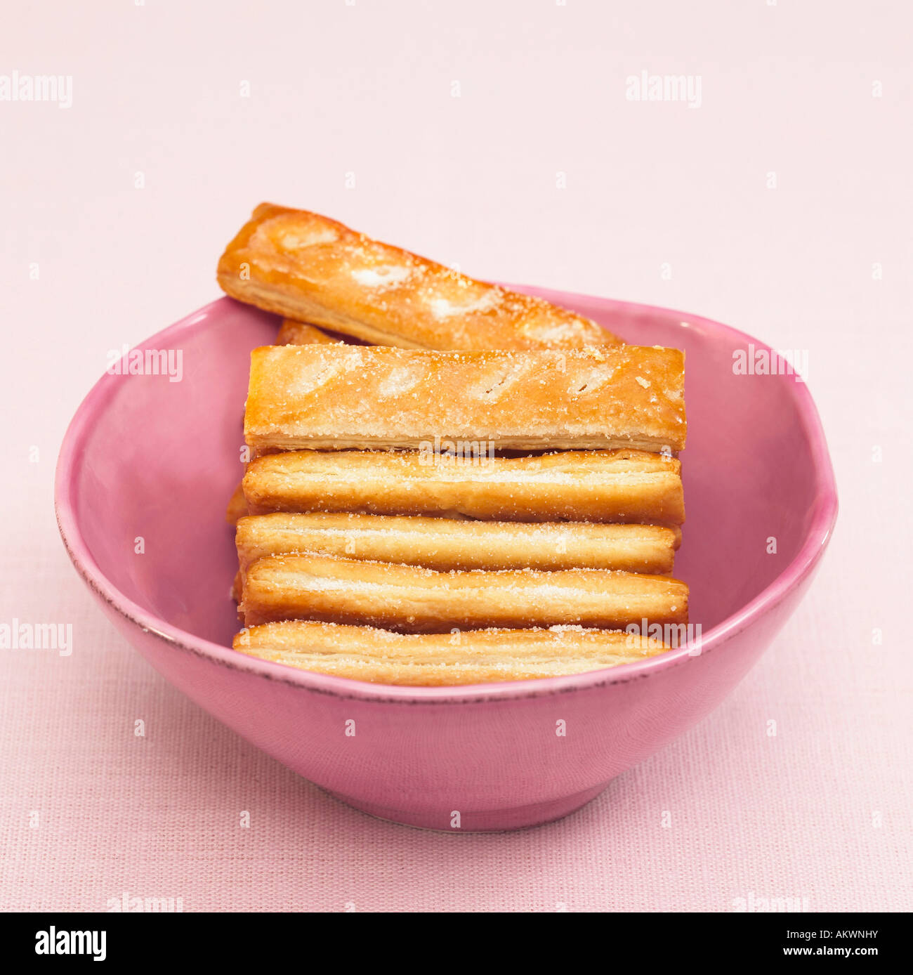 Puff pastry cookies in bowl, close-up Stock Photo - Alamy