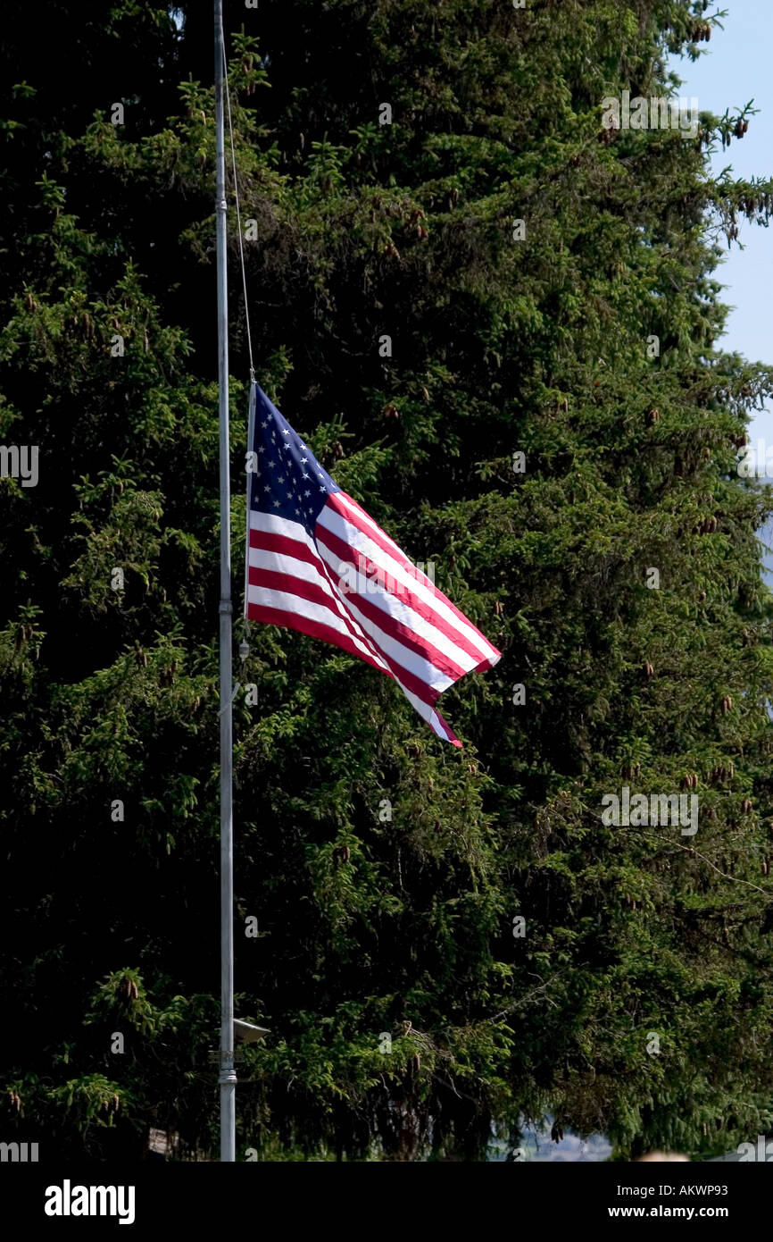American flag flying at half staff on Memorial Day Stock Photo - Alamy