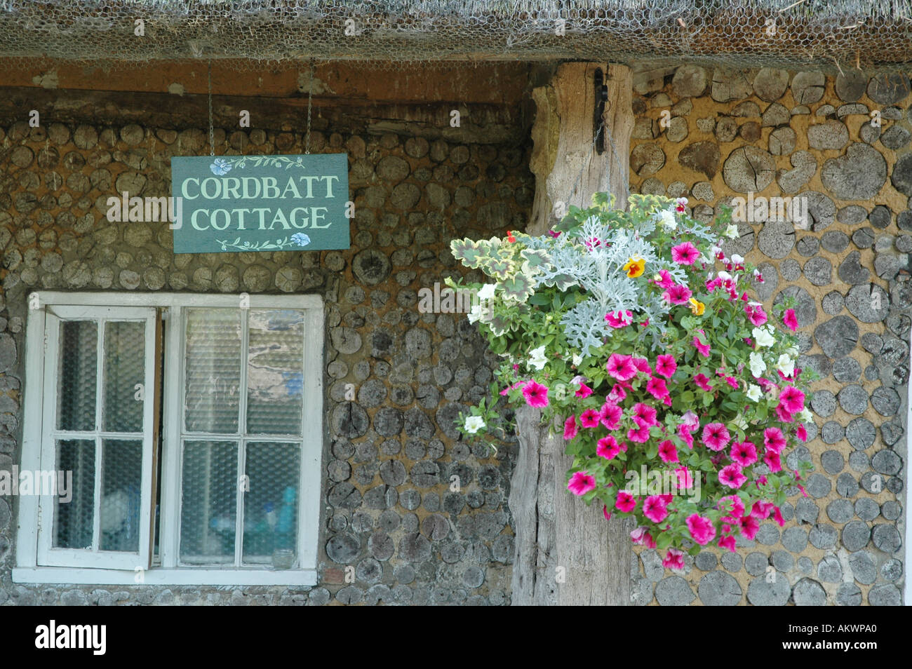 hanging basket outside cottage Stock Photo - Alamy