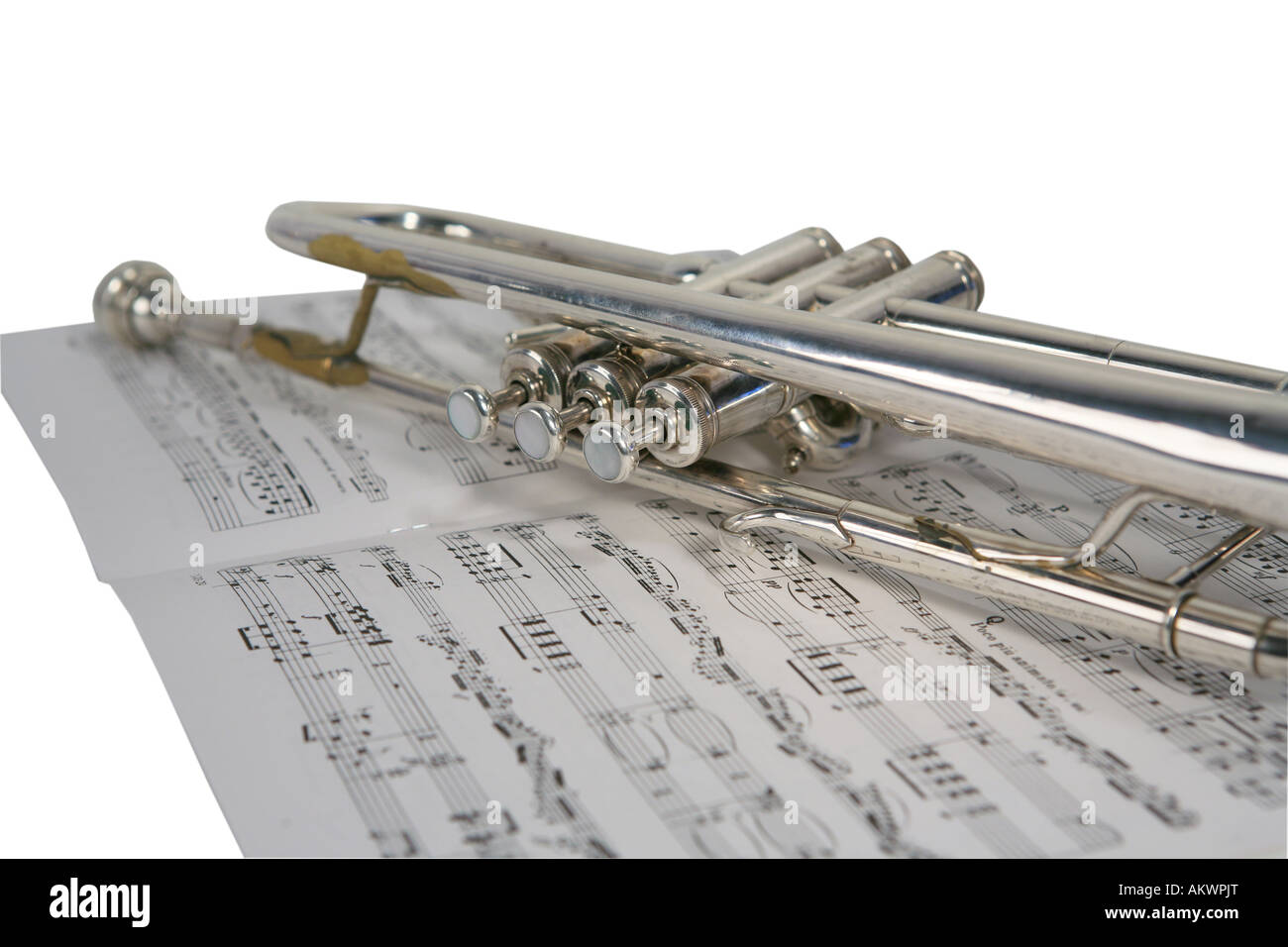 Silver trumpet on top of sheet music Stock Photo - Alamy