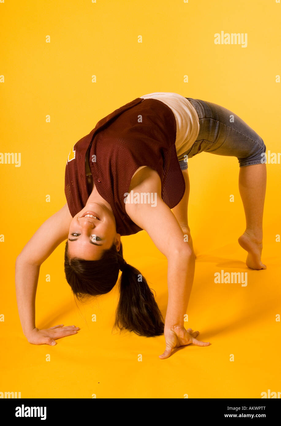 Caucasian Teen Girl (15-17) Turning Back Flip, Practicing Gymnastics ...