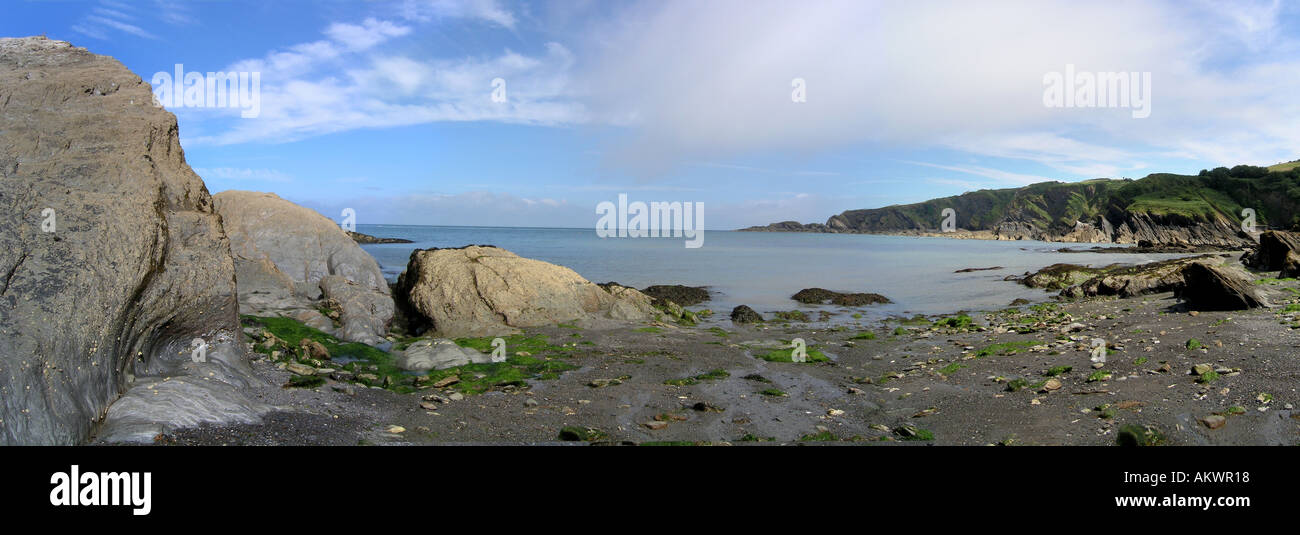beach panorama with rocky shoreline and pebbled beach Hele Bay Devon ...