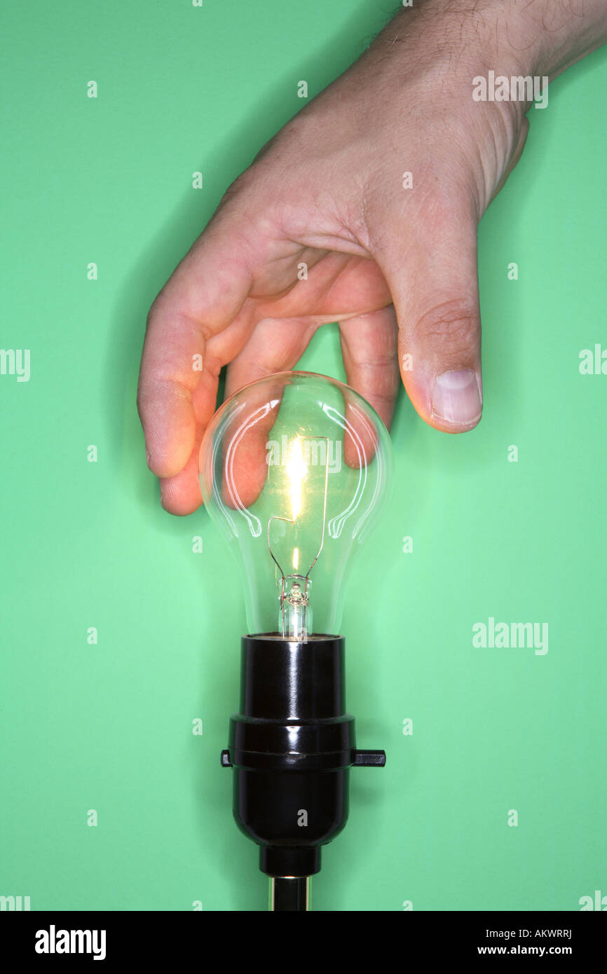 Hand changing lightbulb Stock Photo - Alamy
