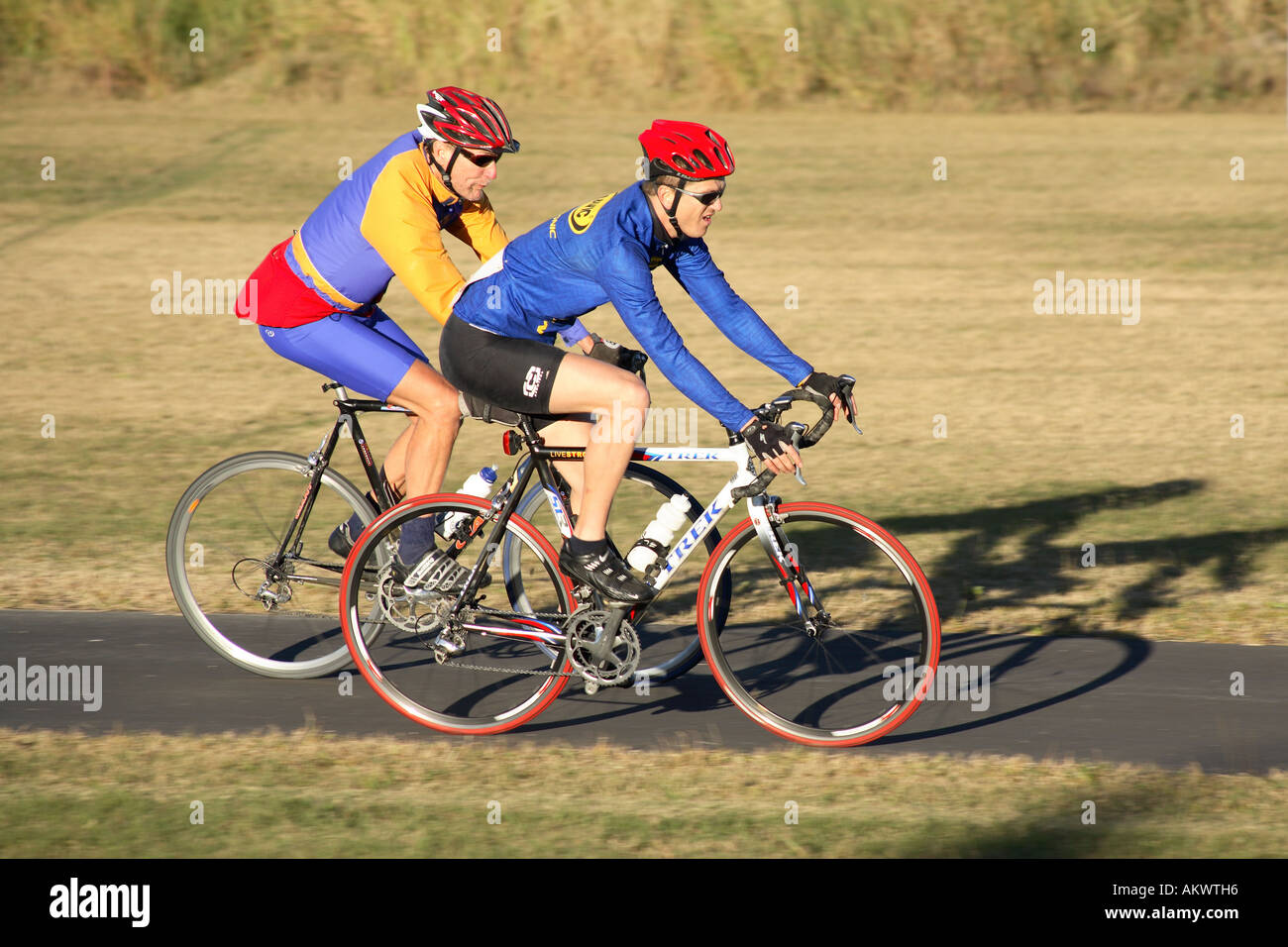 two bicycle riders racing on the track Stock Photo - Alamy