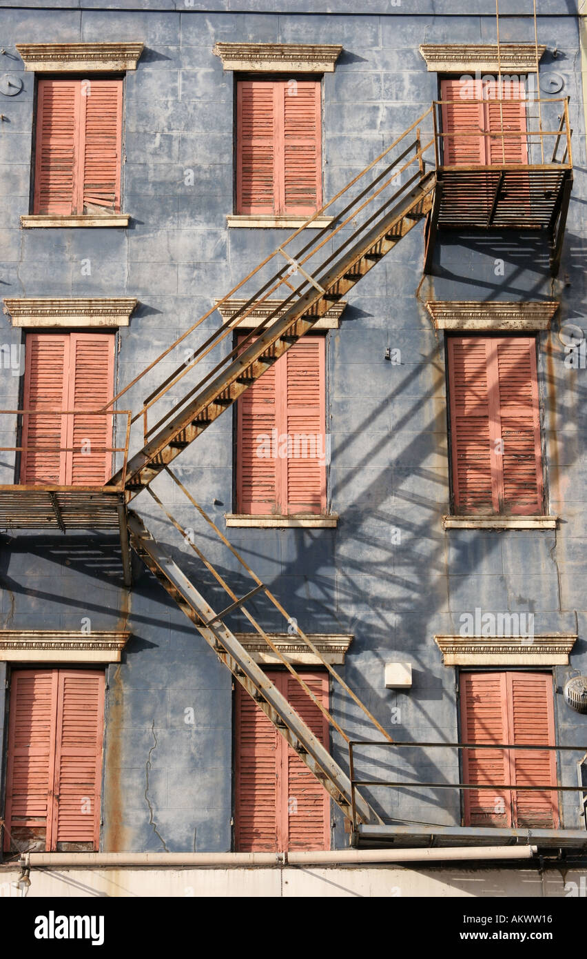 Colorful shutters and fire escape on building on Canal Street New ...