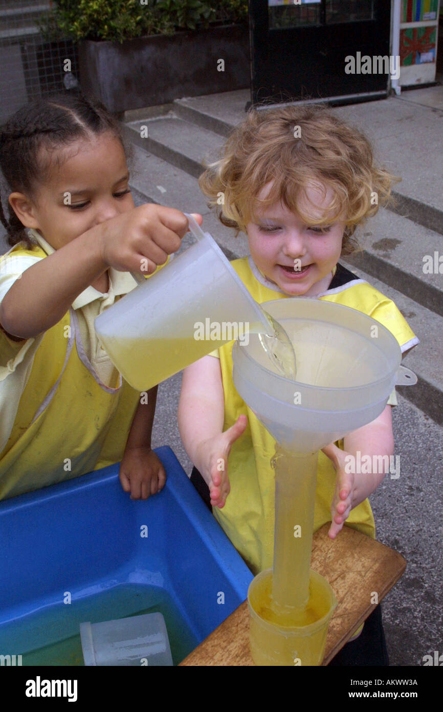 Nursery children playing water hi-res stock photography and images - Alamy