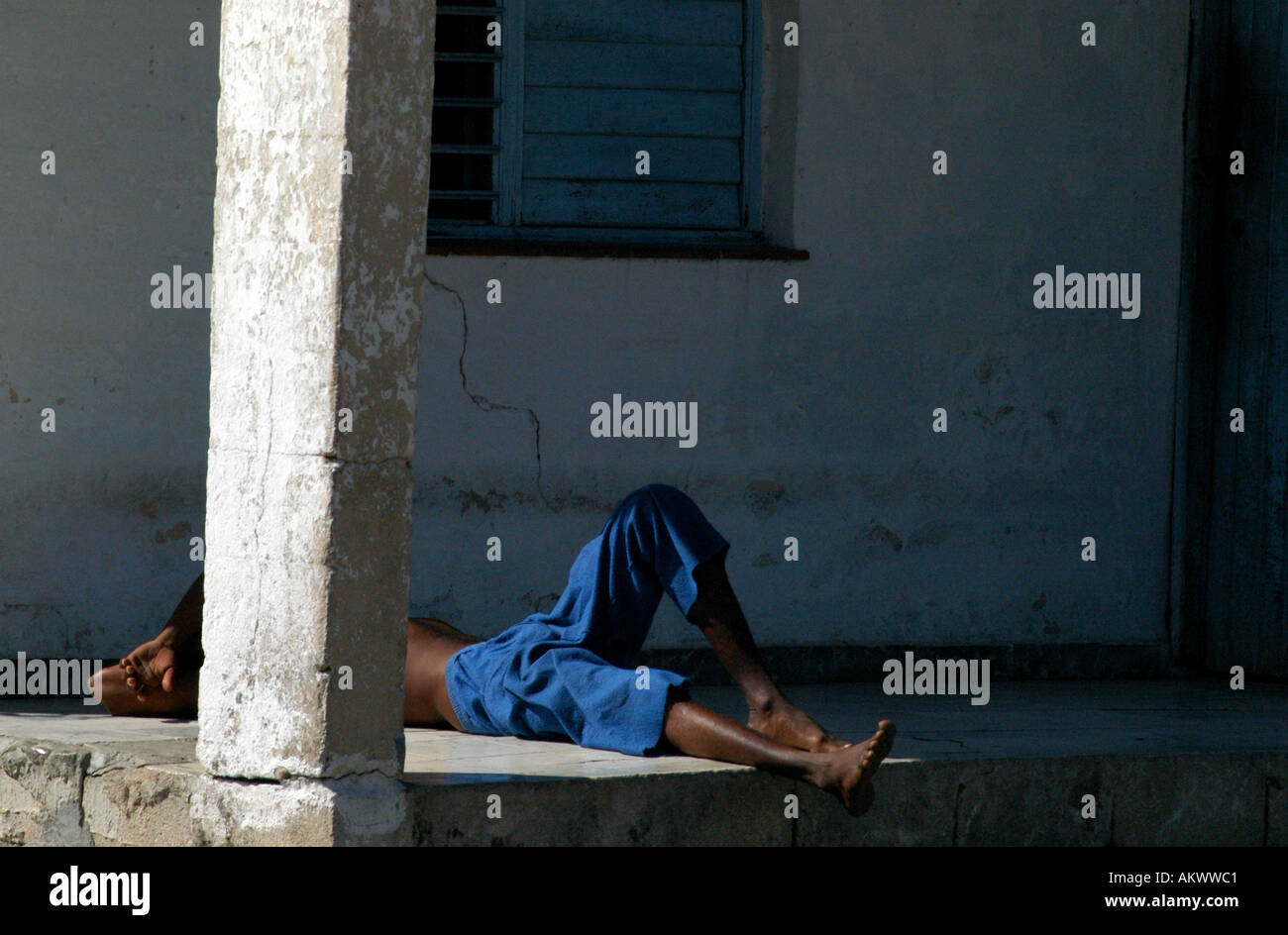 young guy taking a nap in the courtyard of his house in cuba Stock ...