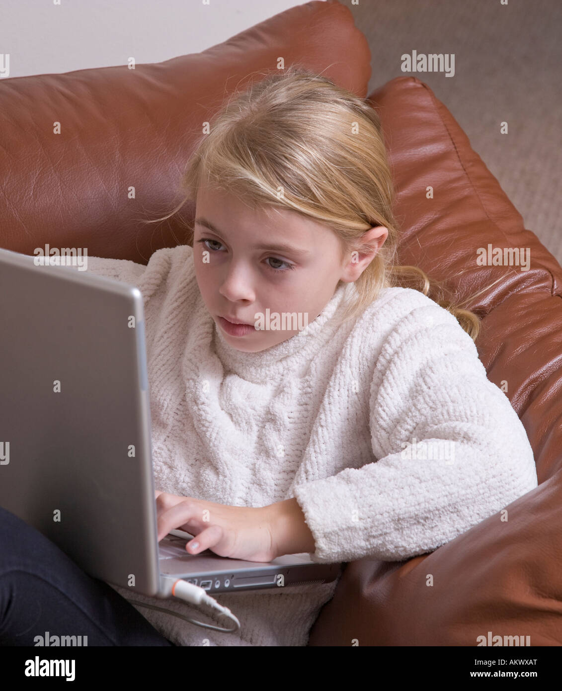Child working on a laptop Stock Photo - Alamy