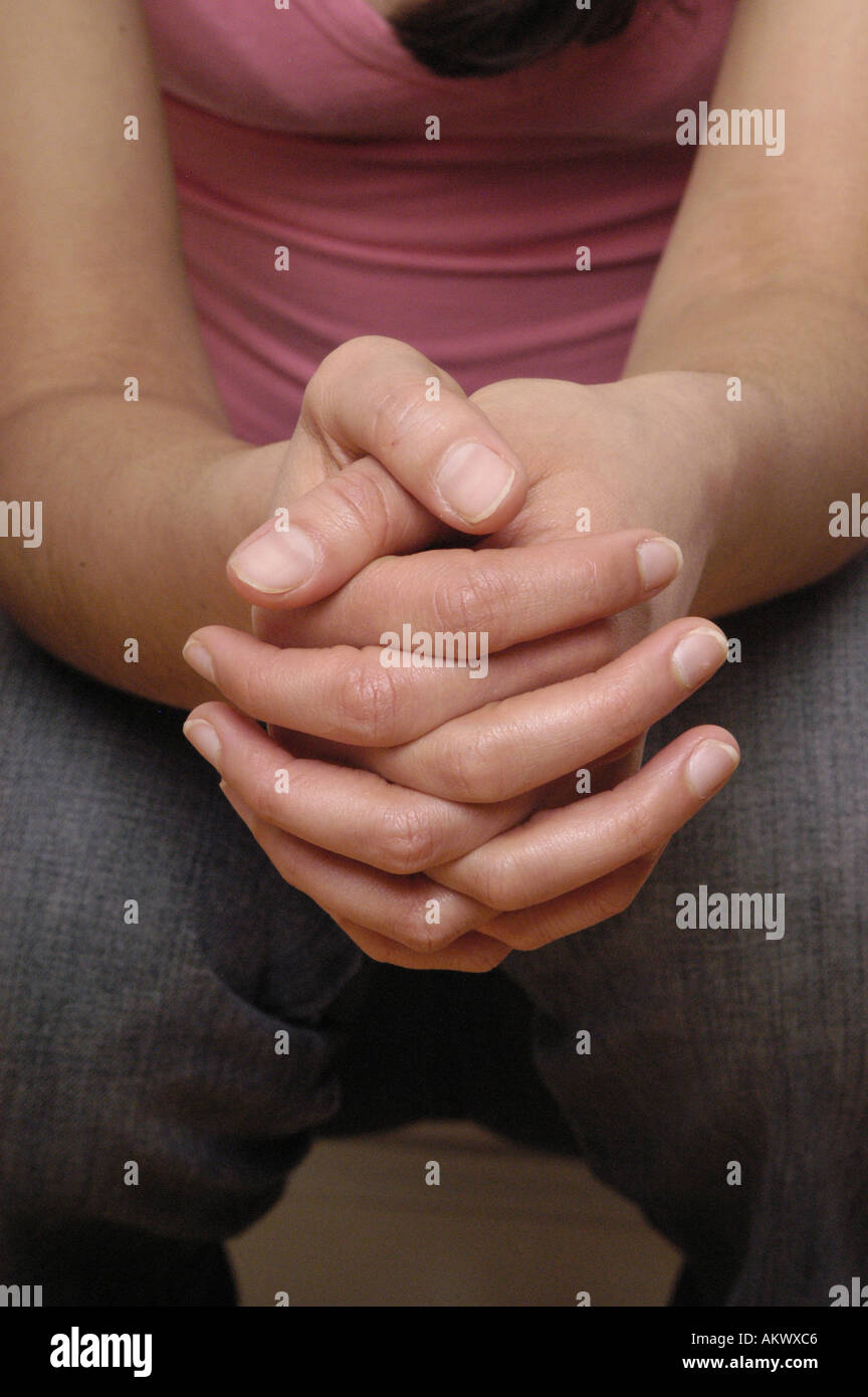 A person's folded hands Stock Photo - Alamy