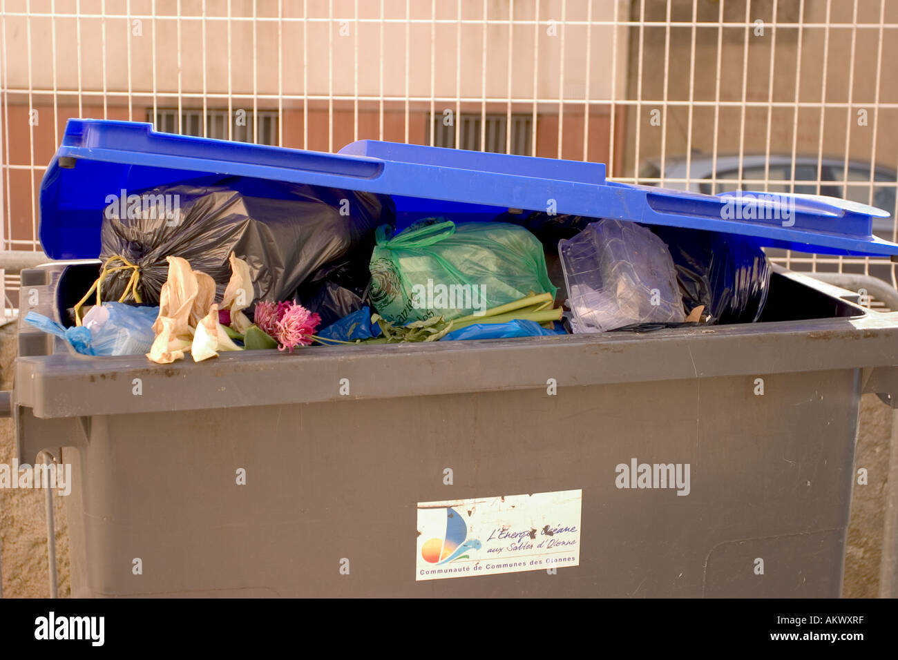 full bin in a street Stock Photo - Alamy